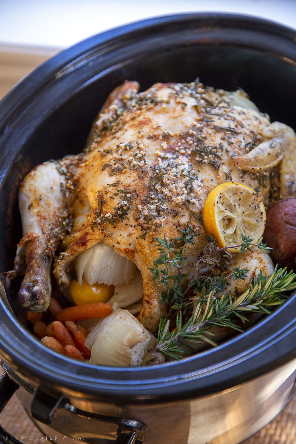 Slow Cooker Whole Chicken with Garlic + Herbs - Ella Claire & Co.